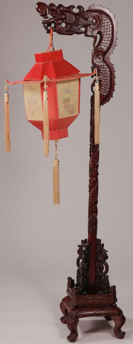 A CHINESE CARVED WOOD DRAGON FLOOR LAMP