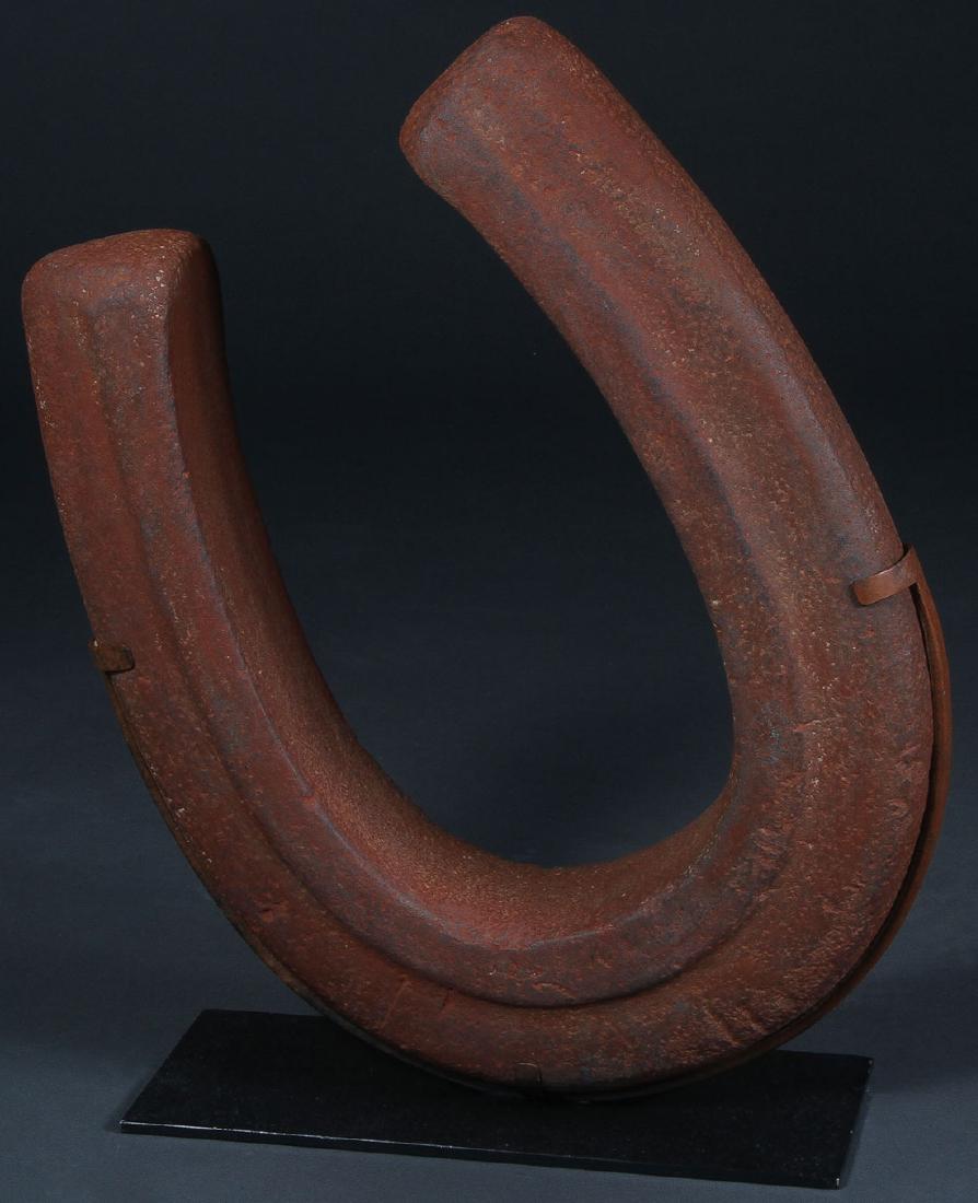 AN IZAPAN STYLE CARVED STONE YOKE, MESOAMERICA