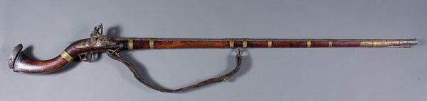 1417: A 19TH CENTURY BRITISH / ARAB MUSKET, with brass
