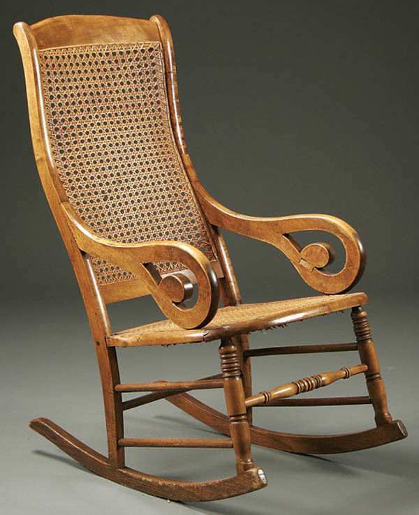 949: A FINE MAPLE "LINCOLN" ROCKER with caned back and