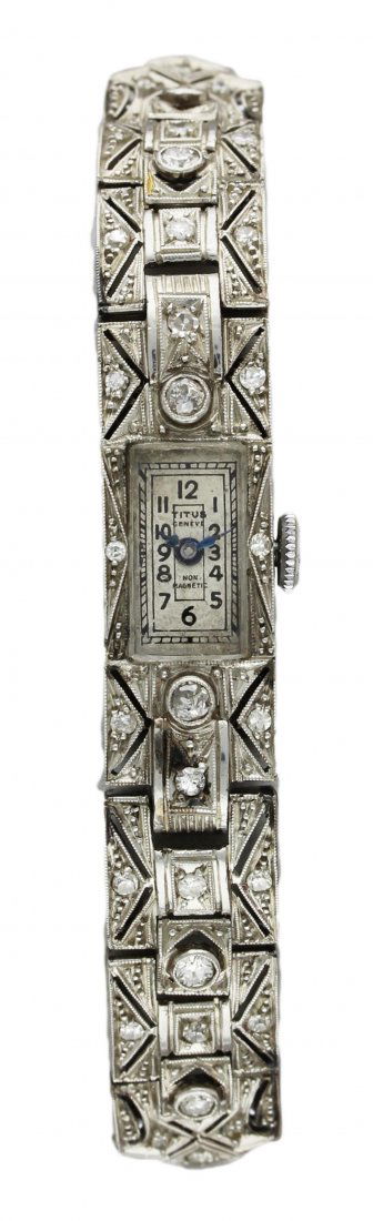A LADIES PLATINUM & DIAMOND TITUS GENEVE COCKTAIL WATCH