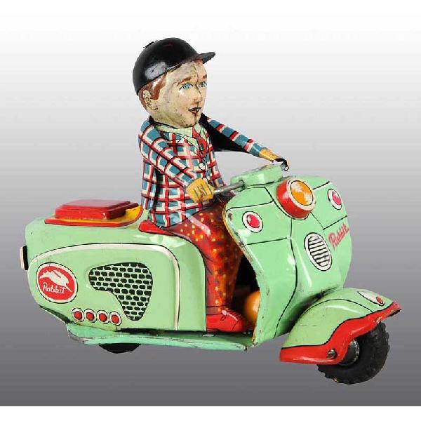 375: Tin Rabbit Scooter Friction Toy.