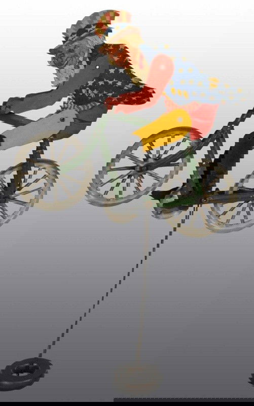 1260: Uncle Sam on Bicycle Toy. - Oct 16, 2010 | Dan Morphy Auctions in PA