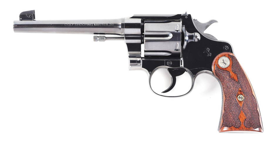 (c) Colt Shooting Master Double Action Revolver.