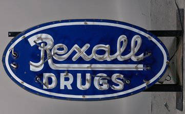 Rexall Drugs Oval Double Sided Neon Porcelain Box Sign.
