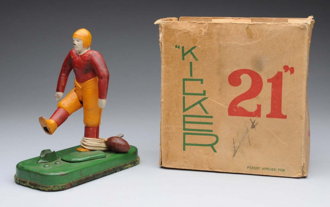 Cast Iron Woolsey No. 21 Football Kicker Toy.