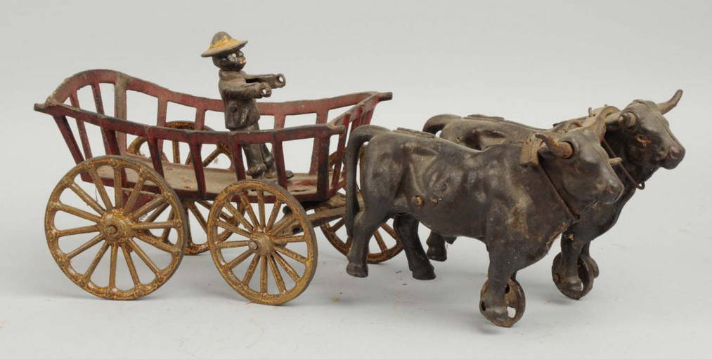Cast Iron Ox Drawn Cart.