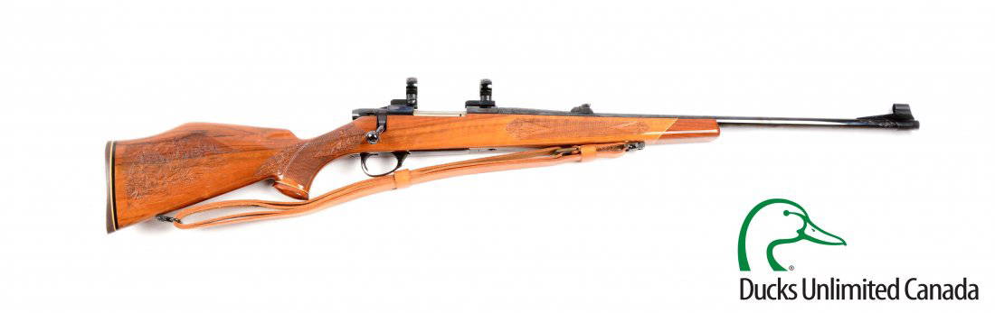 (m) Weatherby Custom Shop Engraved Vanguard Rifle.