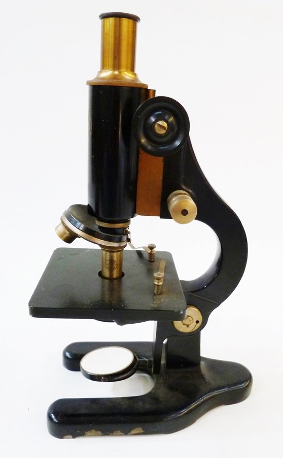 A 20th century microscope by C. Baker, London, in fitte