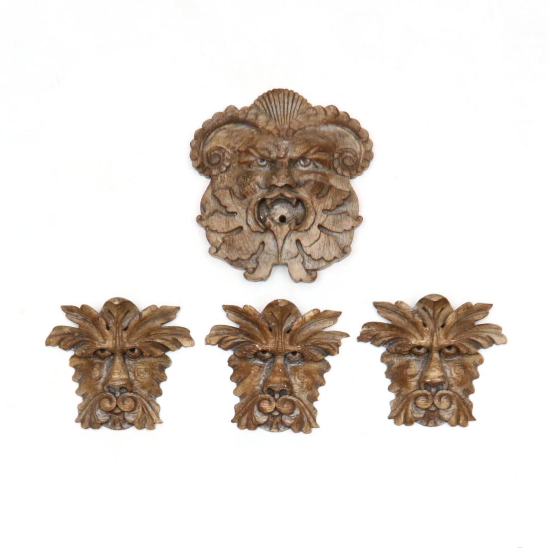 Four Architectural Mask Plaques