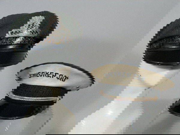 230: Two Vinatge Checker Cab Hats, - Jun 11, 2005 | Leland Little in NC