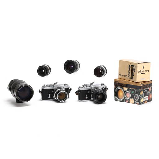 Two Vintage Nikon Cameras With Collection Of Associated Lenses