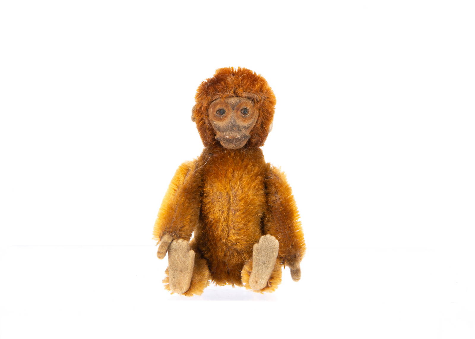 A 1920s Schuco Miniature Monkey Compact, Auction