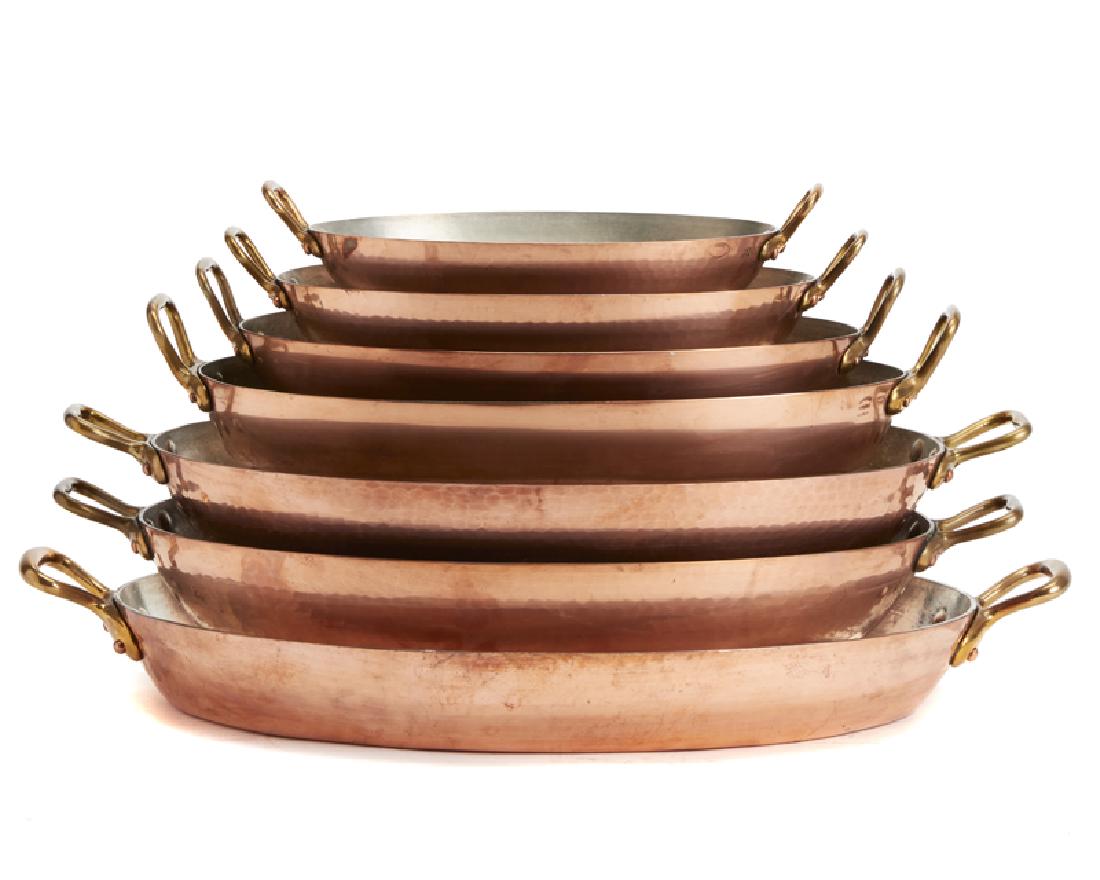 A group of graduated French copper cookware, Bridge