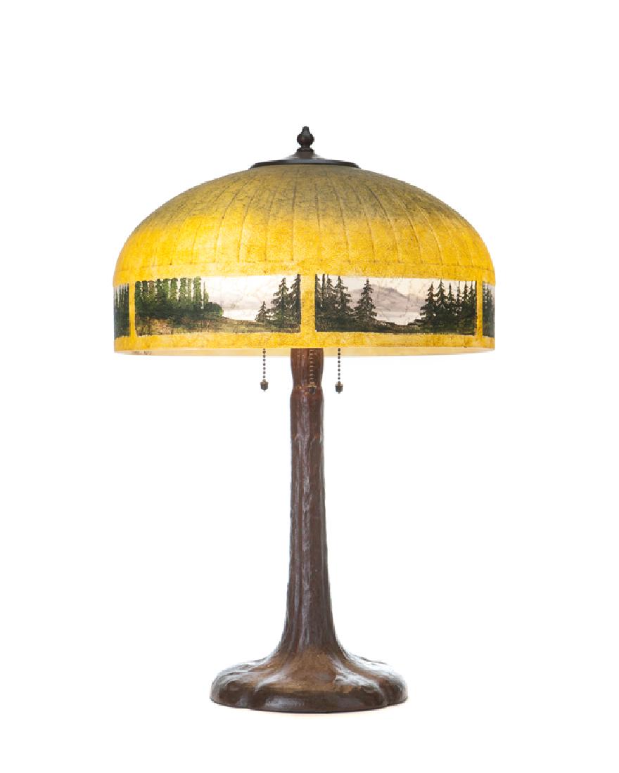 A Handel obverse-painted pine tree-motif table lamp