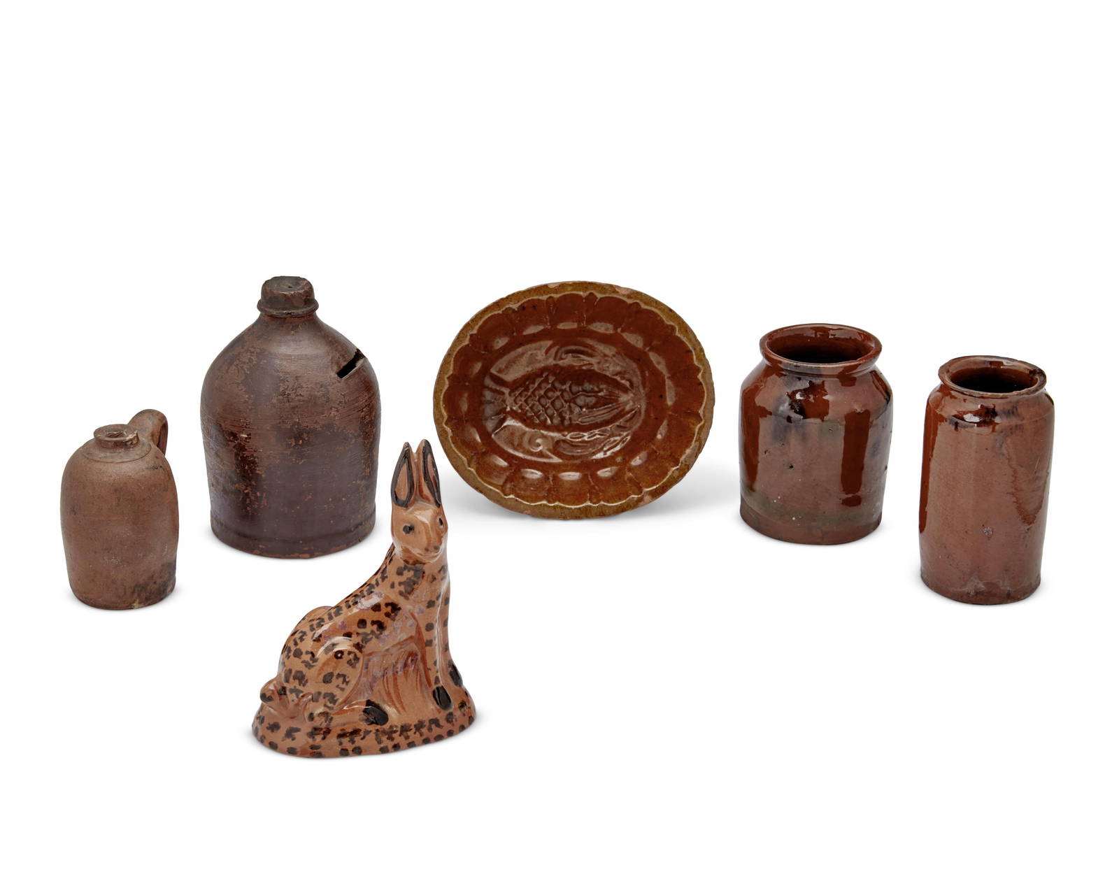 A Group Of Pennsylvania Redware Pottery Items Auction
