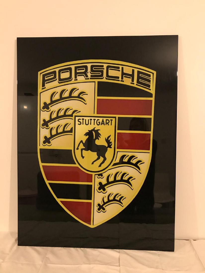 'Porsche' logo wall sign.