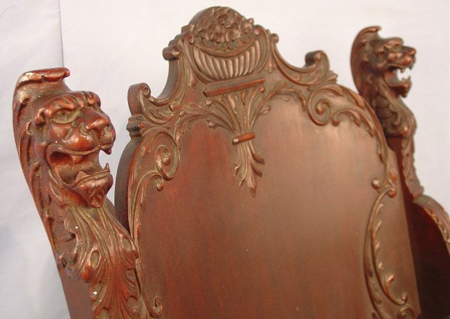 Heavily Carved Mahogany Rocking chair with lions heads : Lot 397