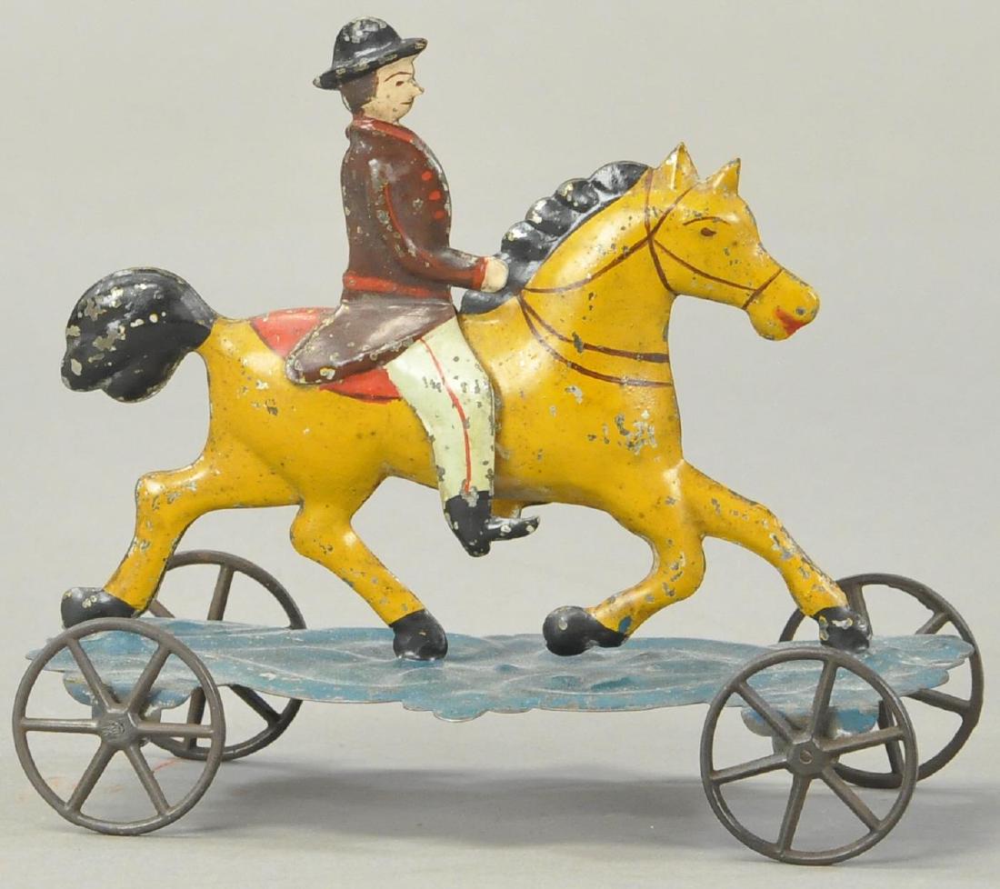 FALLOWS MAN RIDING HORSE TIN TOY