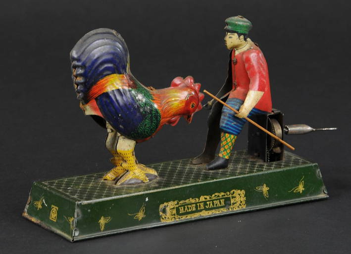 Boy Feeding Rooster Toy