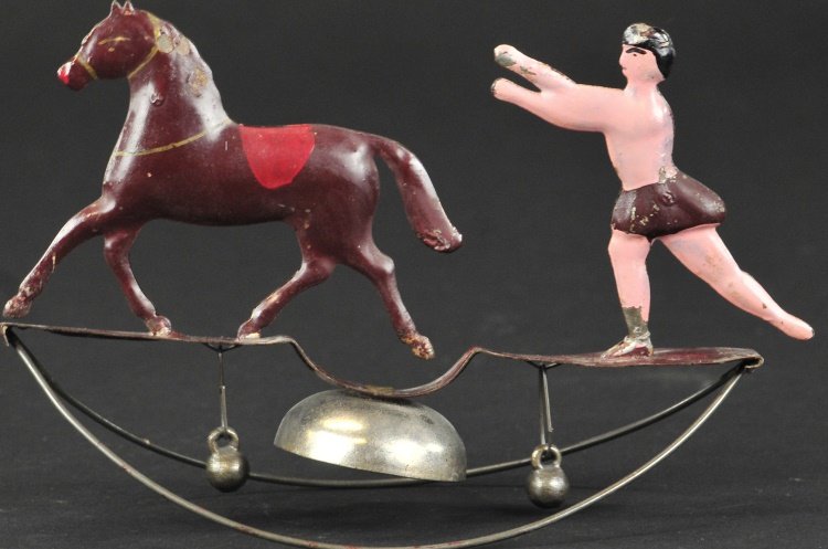 CIRCUS RIDER WITH HORSE BELL TOY