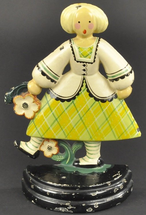 GIRL KICKING FLOWER DOORSTOP