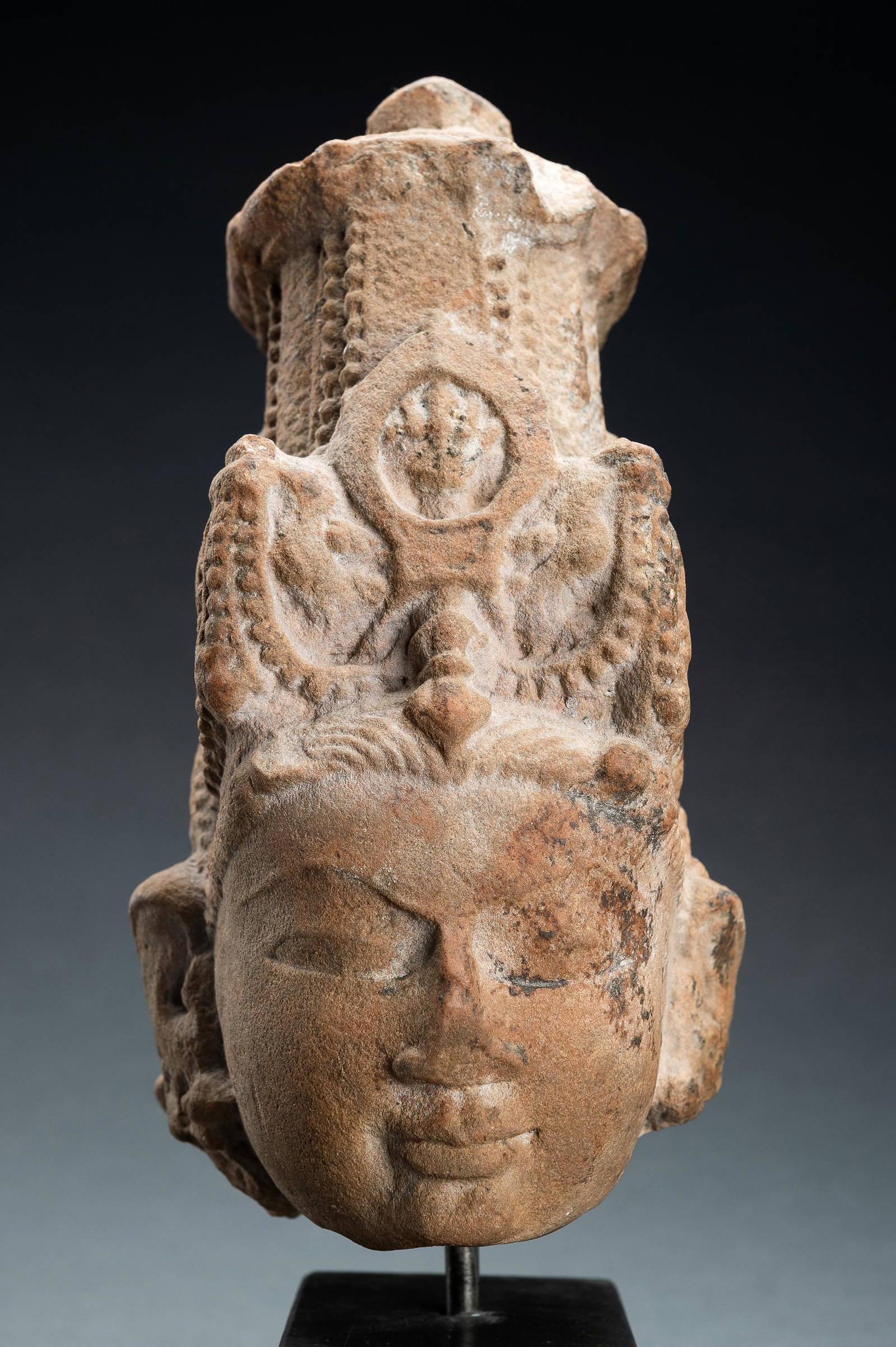 A Red Sandstone Head Of Vishnu With A Miter Crown Auction