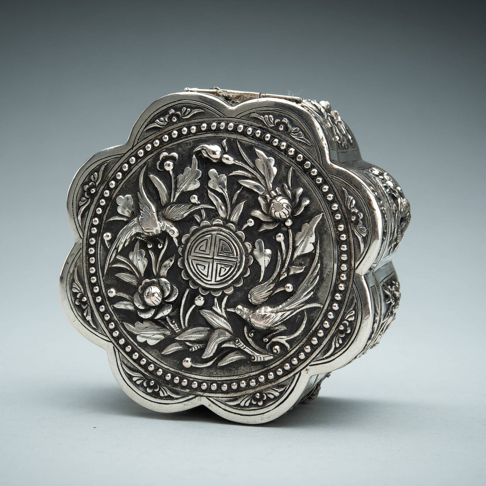 An Octofoil Lidded Silver Box With Flowers And Birds Auction