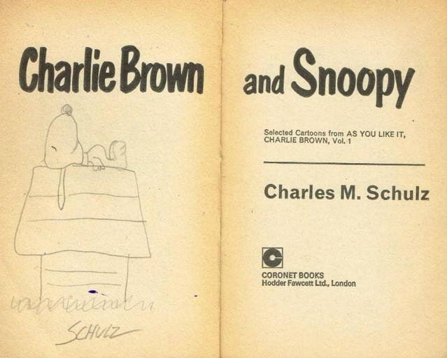 Charles Schulz Drawing Of Snoopy In Book.