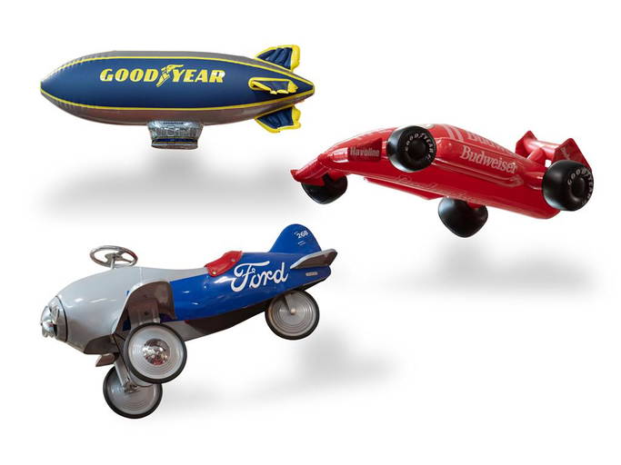 Inflatable Budweiser Race Car, Goodyear Blimp, And Ford Themed Pedal Plane
