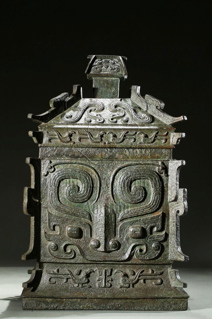 ARCHAIC BRONZE 'TAOTIE' RECTANGULAR RITUAL VESSEL, YI