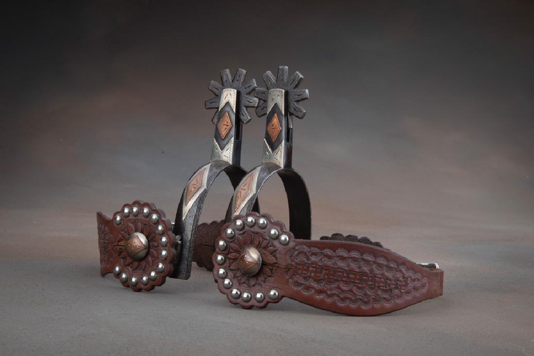 A pair of double mounted Spurs by Oklahoma Bit and Spur