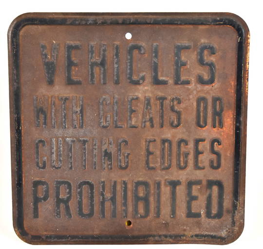 Old Vehicle With Cleats Prohibited Sign
