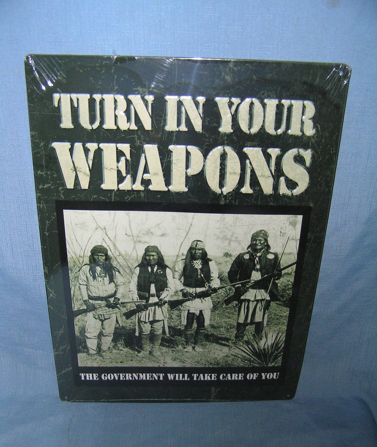 Turn In Your Weapons All Tin Advertising Sign Auction