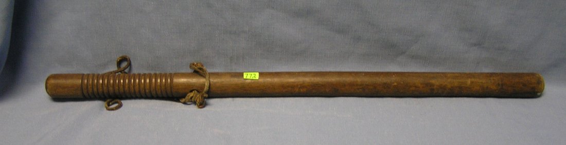 Antique police baton with carved handle
