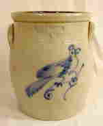 A stoneware crock, 4 gallon, decorated with a cobalt blue bird on ...