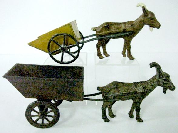 19: 2 Cast Iron Goats Pulling Carts
