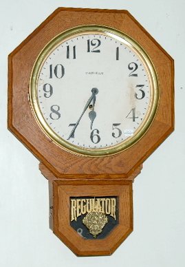 Ingraham Long Drop “Postal” Clock. Oak case Price Guide