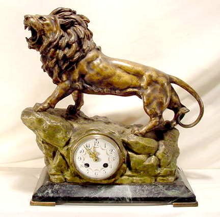 1037: Full figural lion French table clock