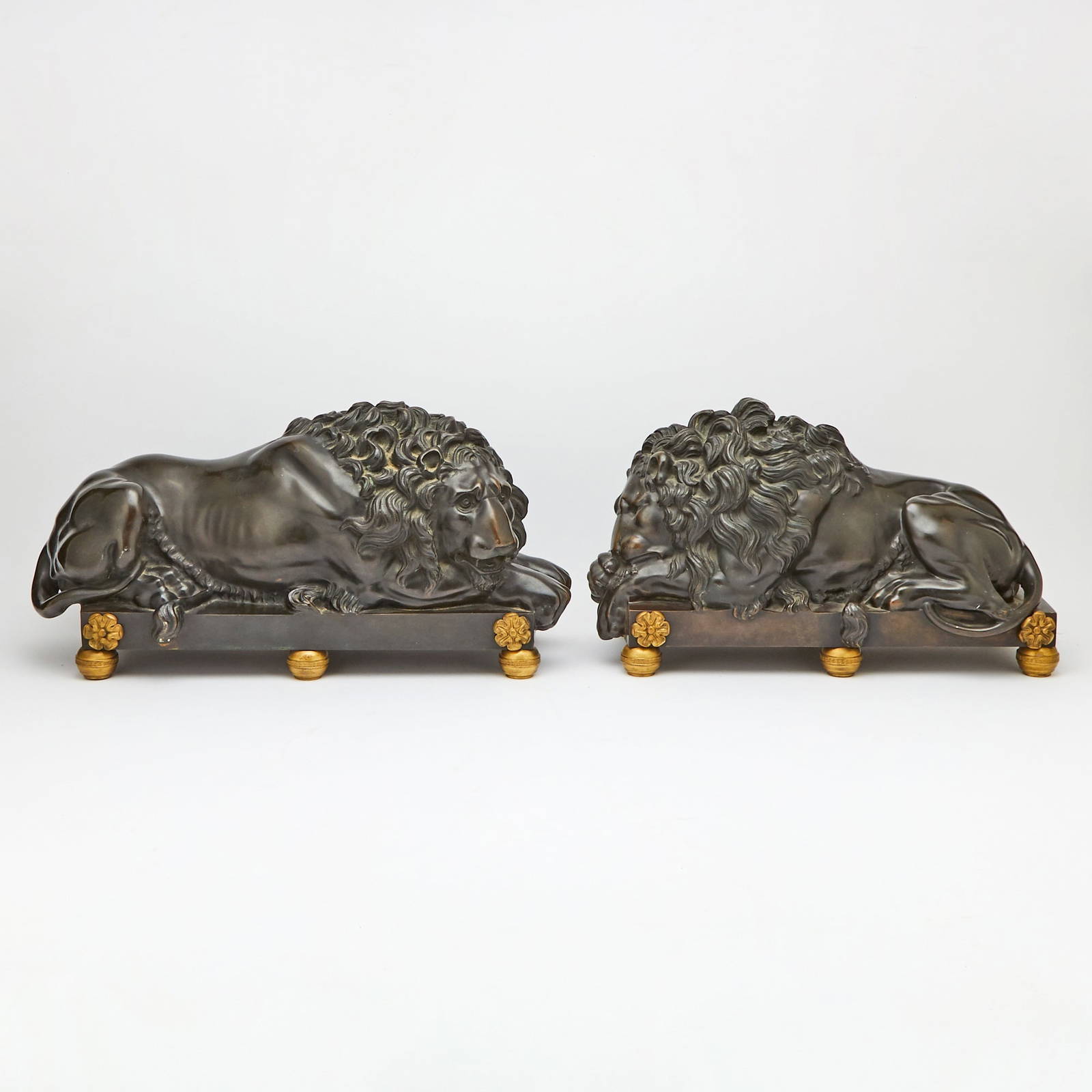 Pair Of Patinated And Gilt-bronze Figures Of Lions Auction