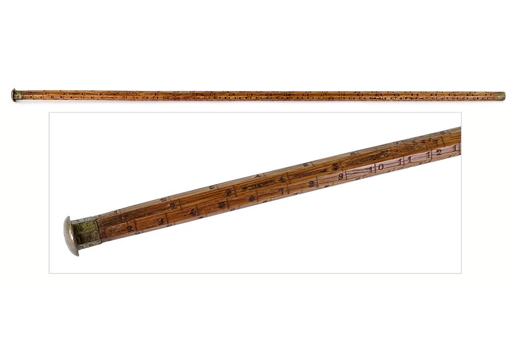 An Eight Sided Timber Logging Walking Stick.