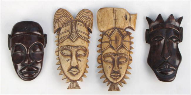 Group Of Four African Carved Ivory Masks.