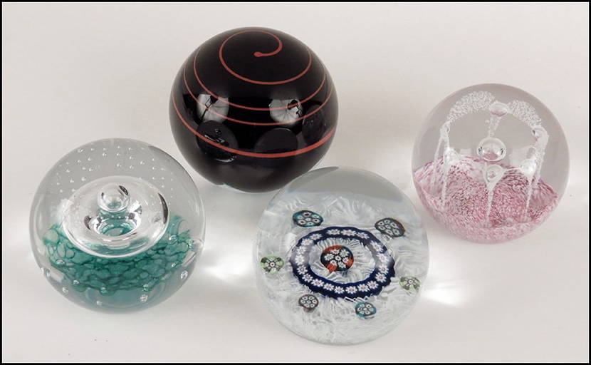 Four Caithness Paperweights.
