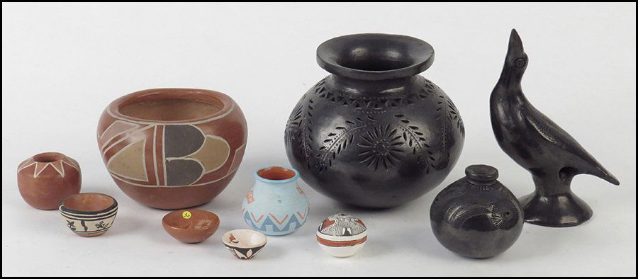 TWO SIMON REYES BLACKWARE JARS.