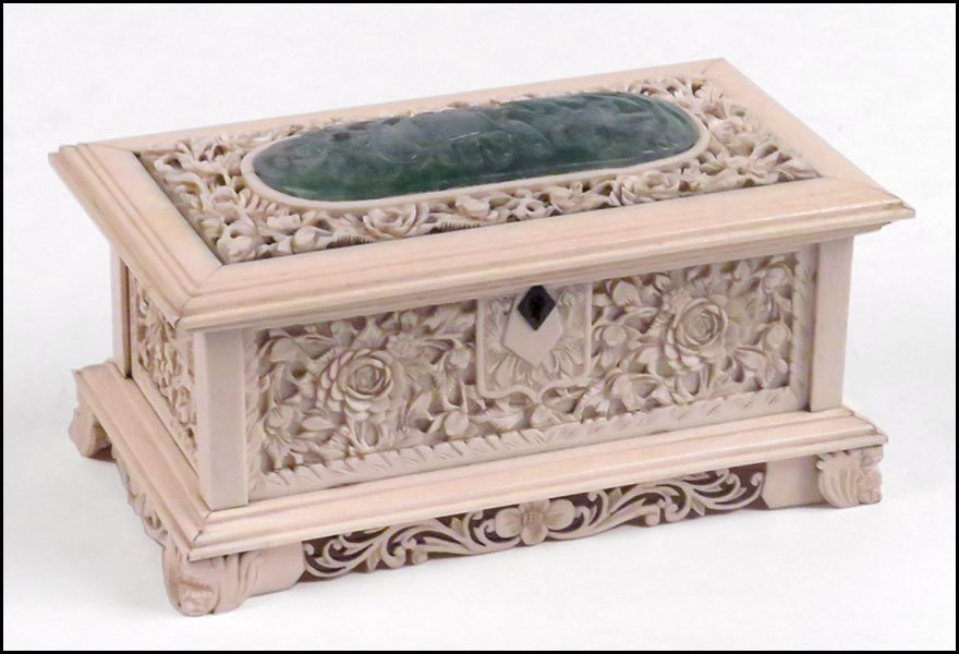 A 19TH CENTURY CARVED AND RETICULATED IVORY CASKET.