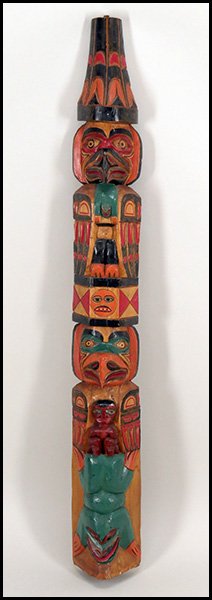 CARVED AND PAINTED WOOD TOTEMIC FIGURE.