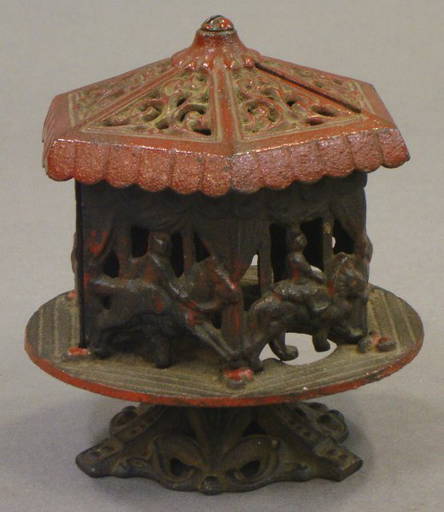 Cast Iron Revolving Carousel Bank In Original Pain