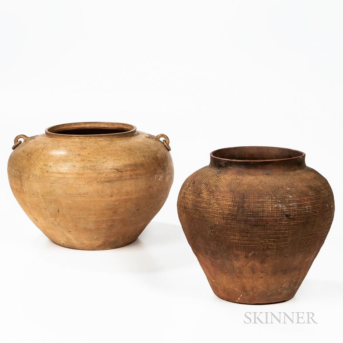 Two Archaic Ash-glazed Storage Jars, China, Han dynasty, a yellow ...