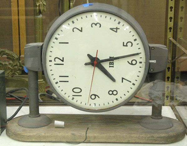 182: Double sided, electric wall clock IBM