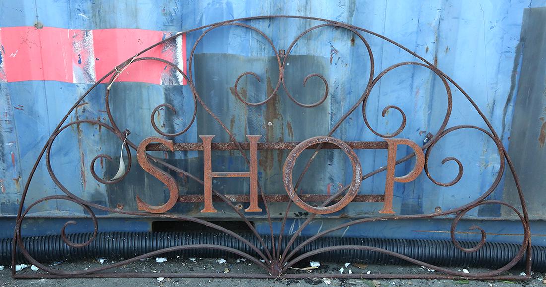 Large wrought iron shop sign, with scrolled accents, 34